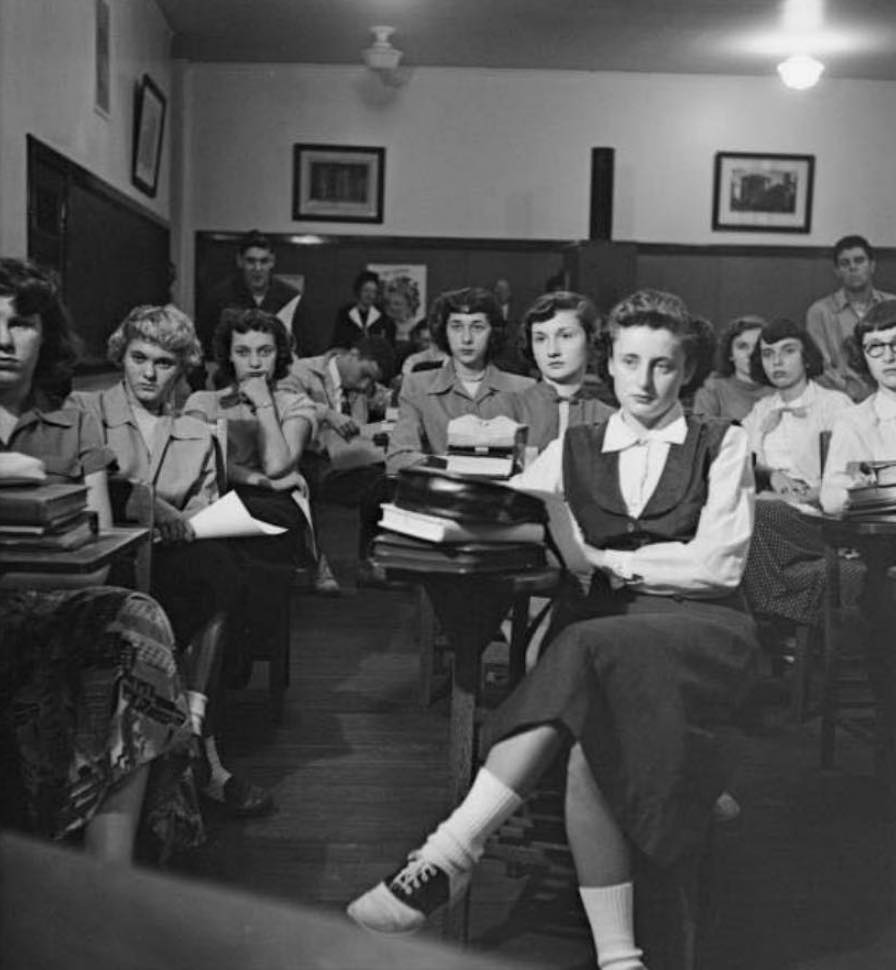 Historical - High school students intently watching a television being ...