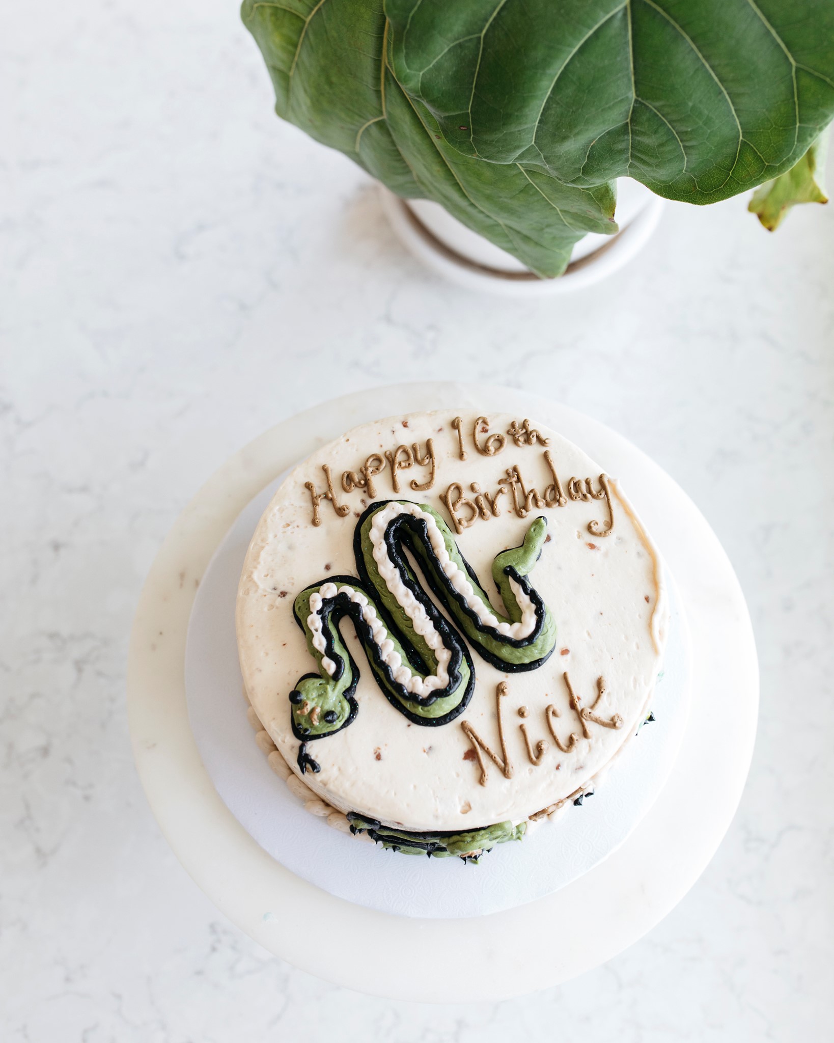 Snakes and cakes go well... - Cake and Cup Bake Shoppe