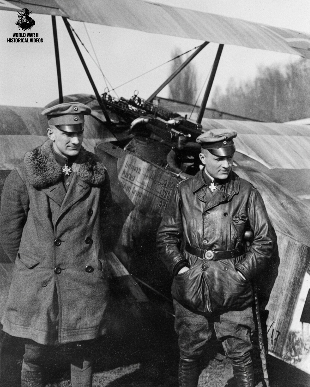 WORLD - Two aviators stand before their aircraft faces calm, eyes ...